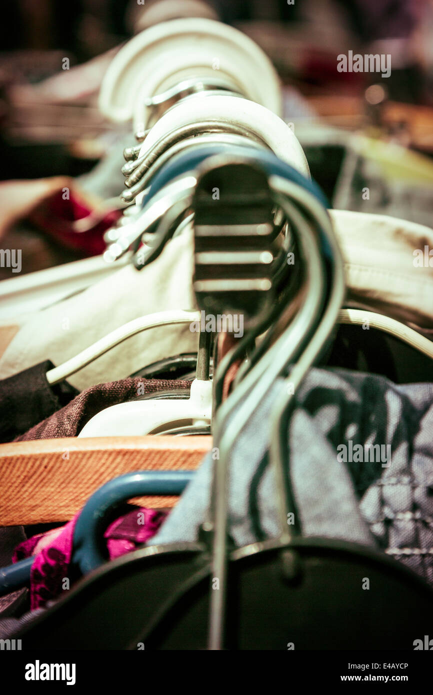 clothes on a rack on a flea market Stock Photo - Alamy