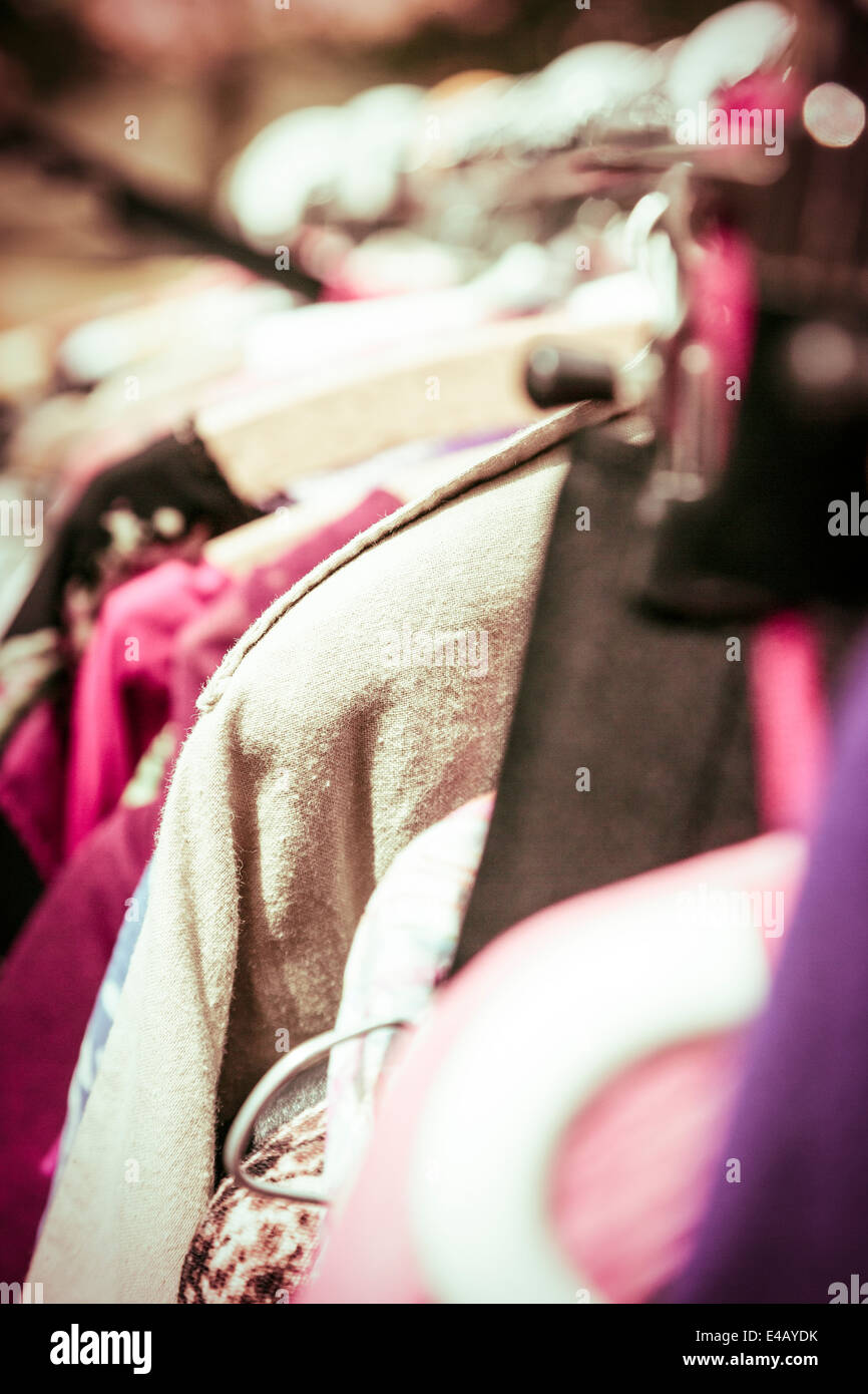 clothes on a rack on a flea market Stock Photo - Alamy