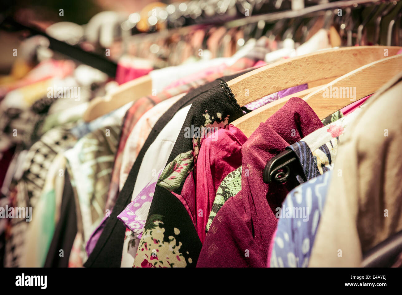 clothes on a rack on a flea market Stock Photo - Alamy