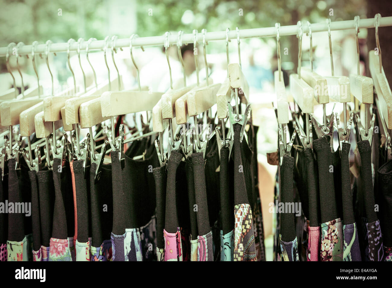 clothes on a rack on a flea market Stock Photo - Alamy