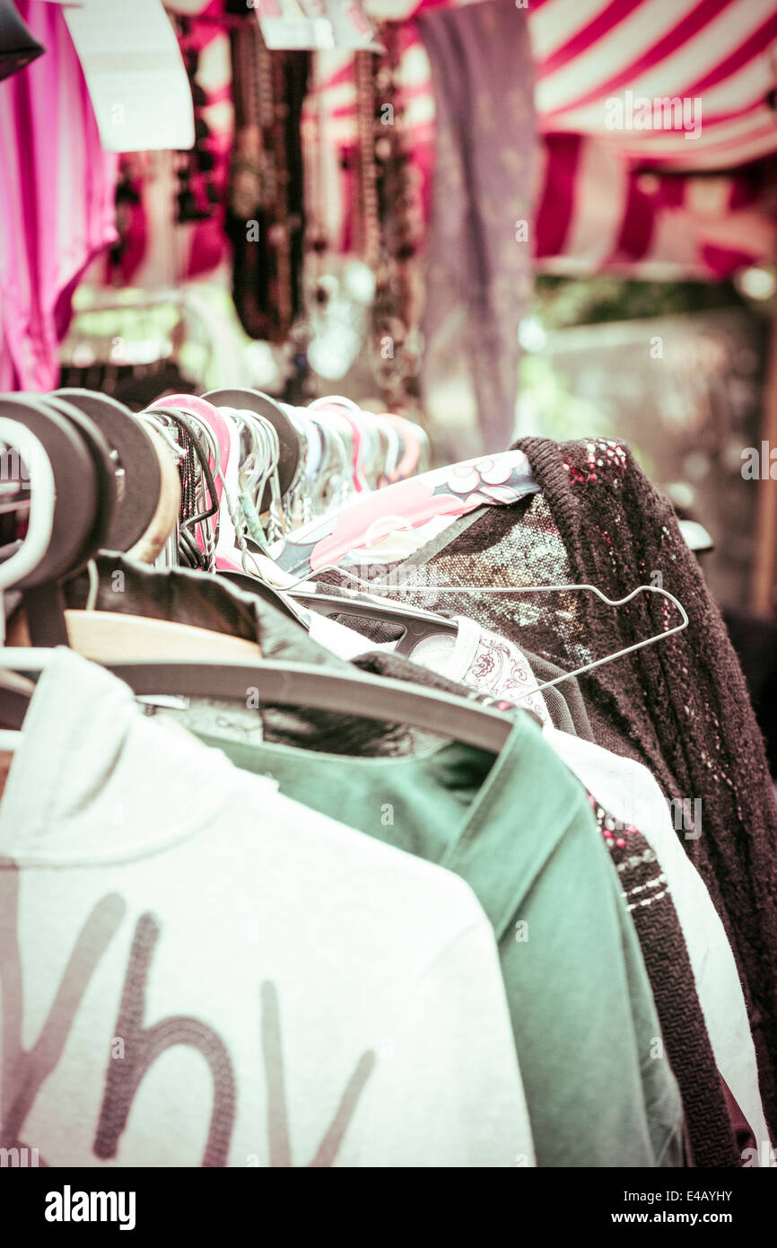 clothes on a rack on a flea market Stock Photo - Alamy