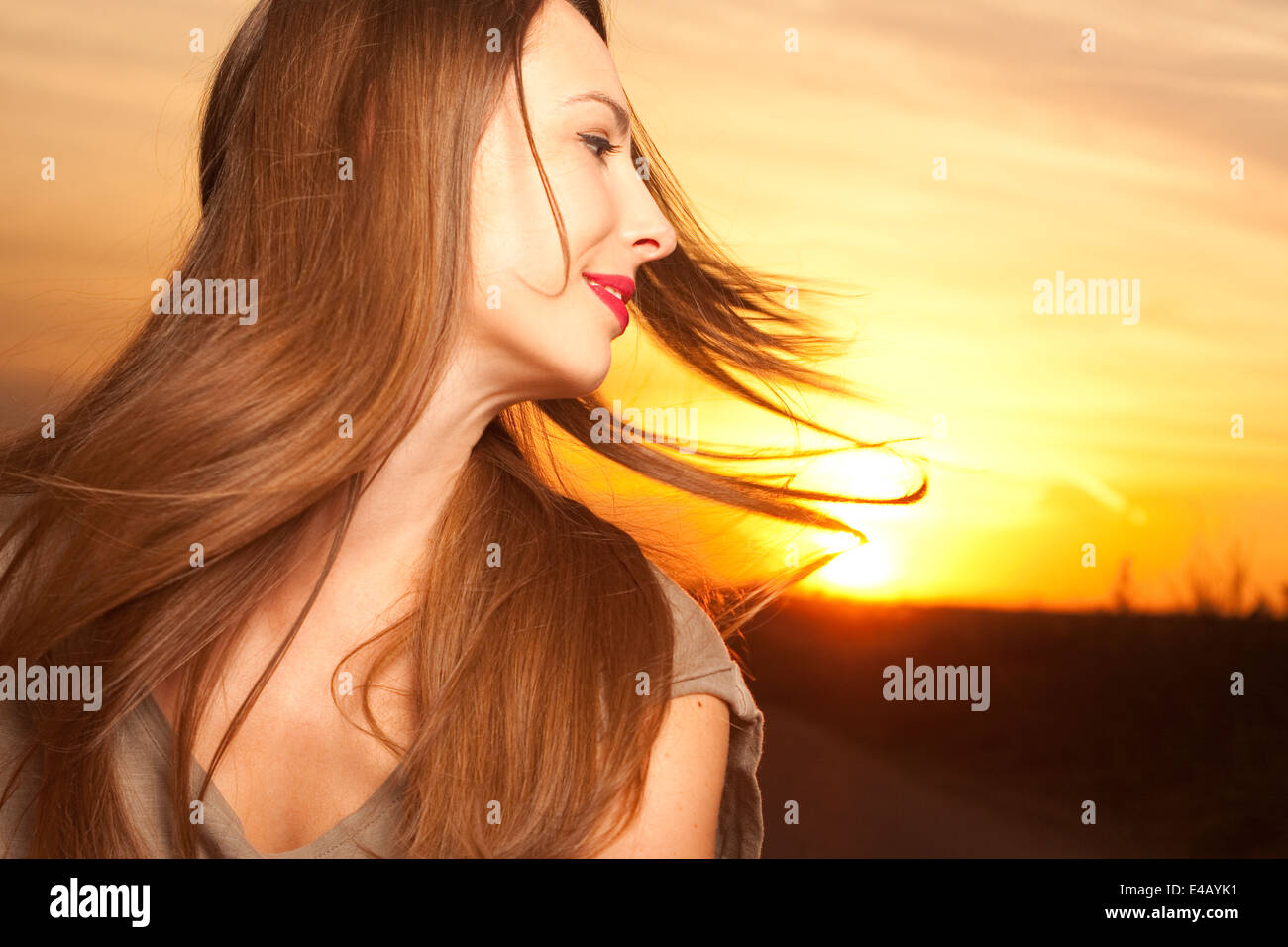 Beautiful, happy young woman in sunlight Stock Photo - Alamy Beautiful, happy young woman in sunlight Stock Photo - Alamy