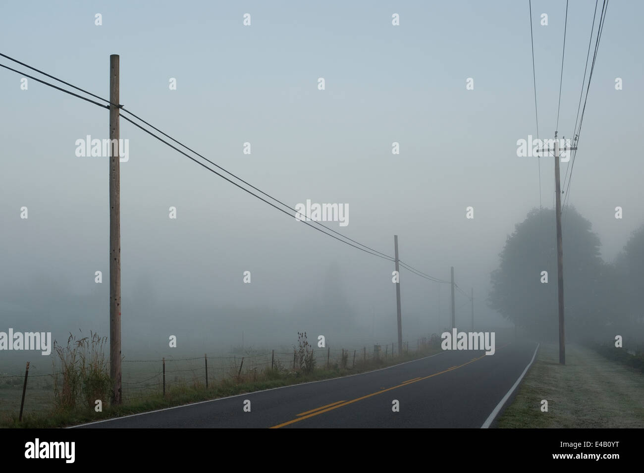 Valley fog with rural back road Stock Photo - Alamy