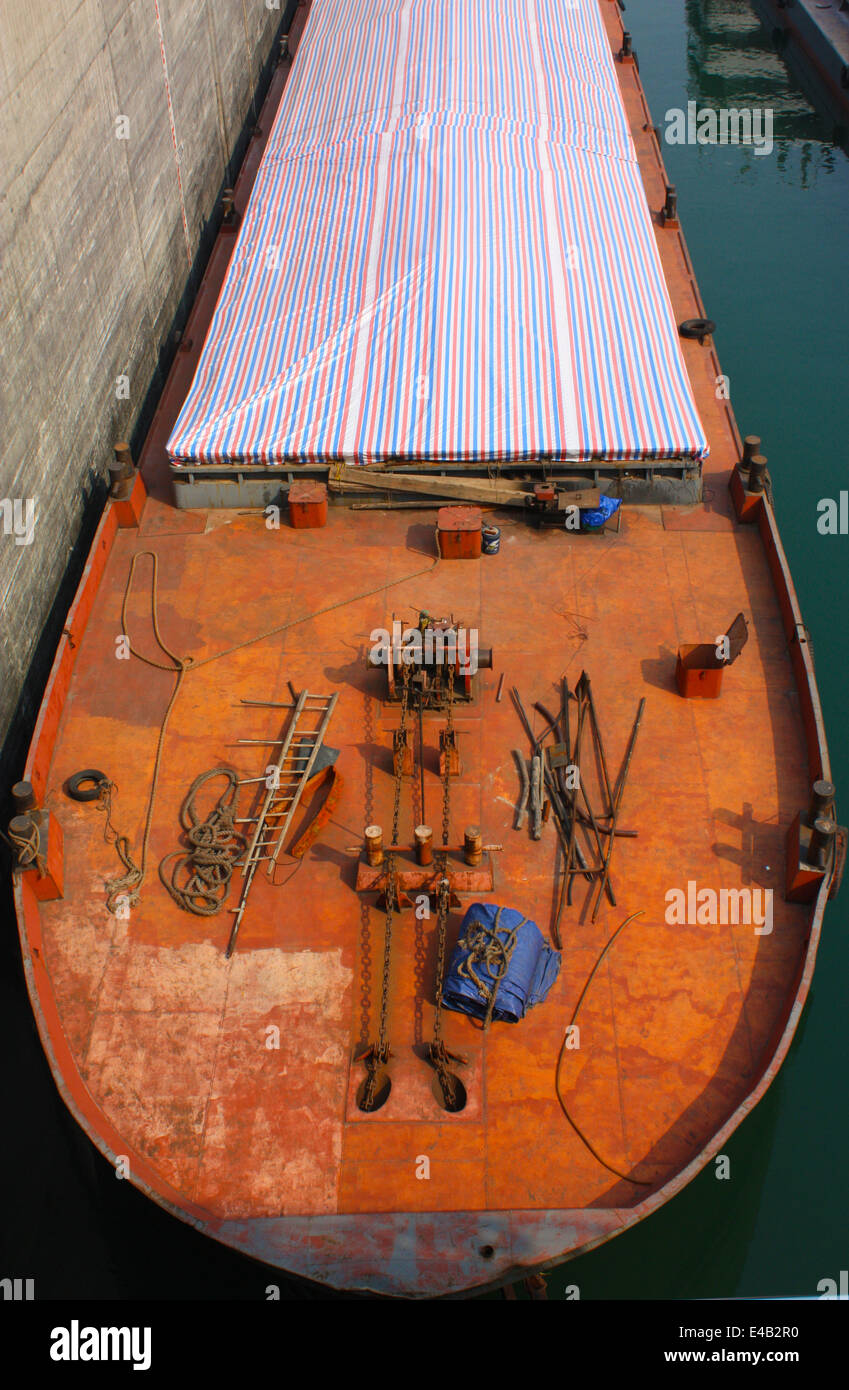 Large cargo or transport ship, rusting, taken at high angle. On the ...
