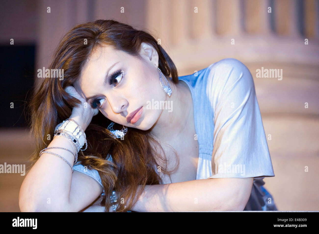 Latin woman with bored look on her face Stock Photo - Alamy
