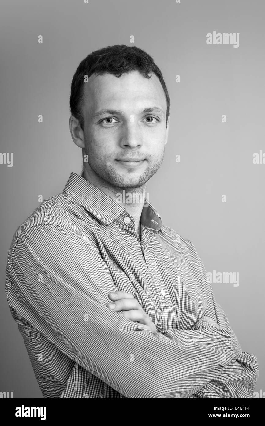 Young Caucasian Man, black and white studio portrait Stock Photo - Alamy