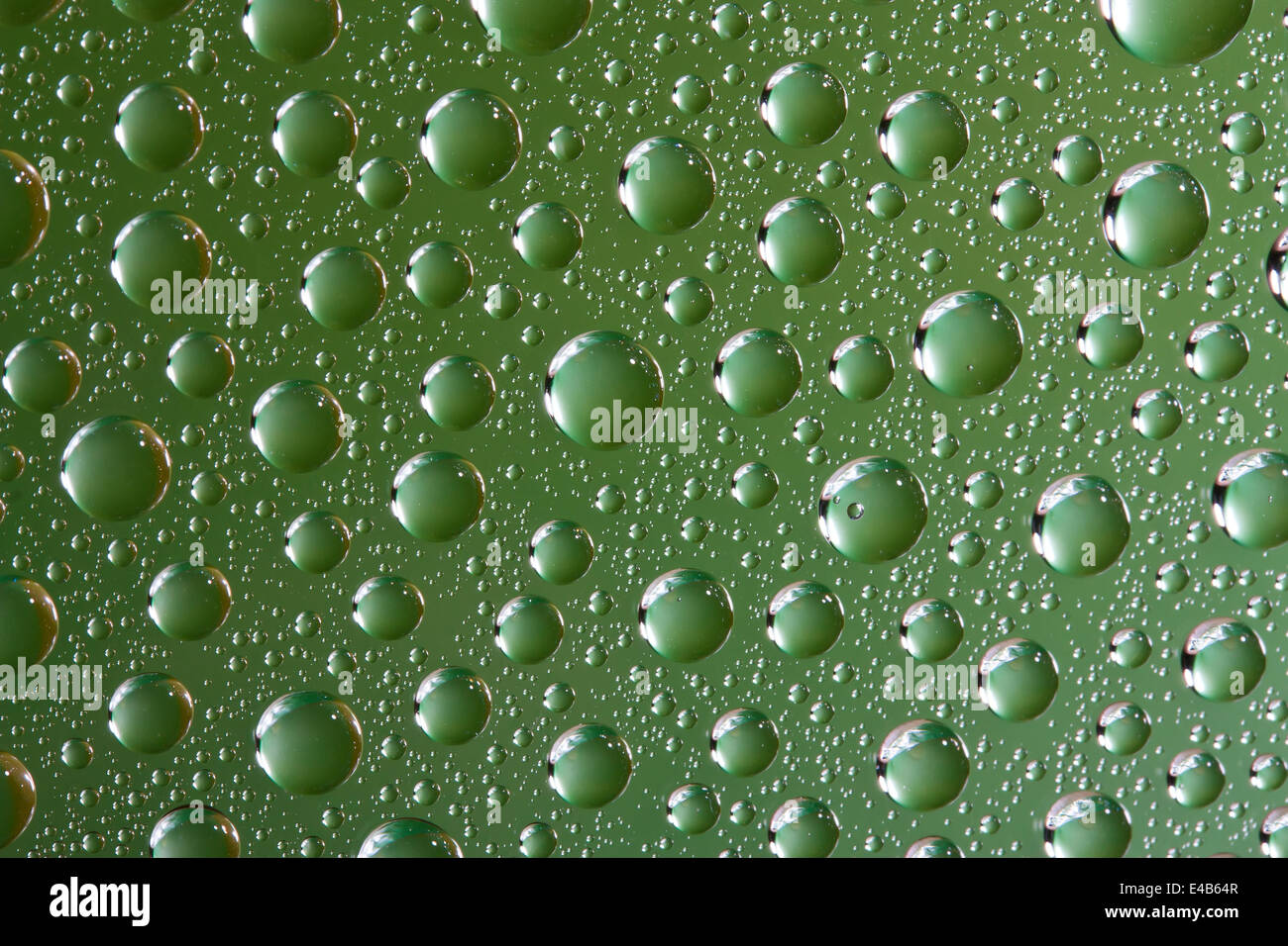 Water drops on green glass surface Stock Photo - Alamy