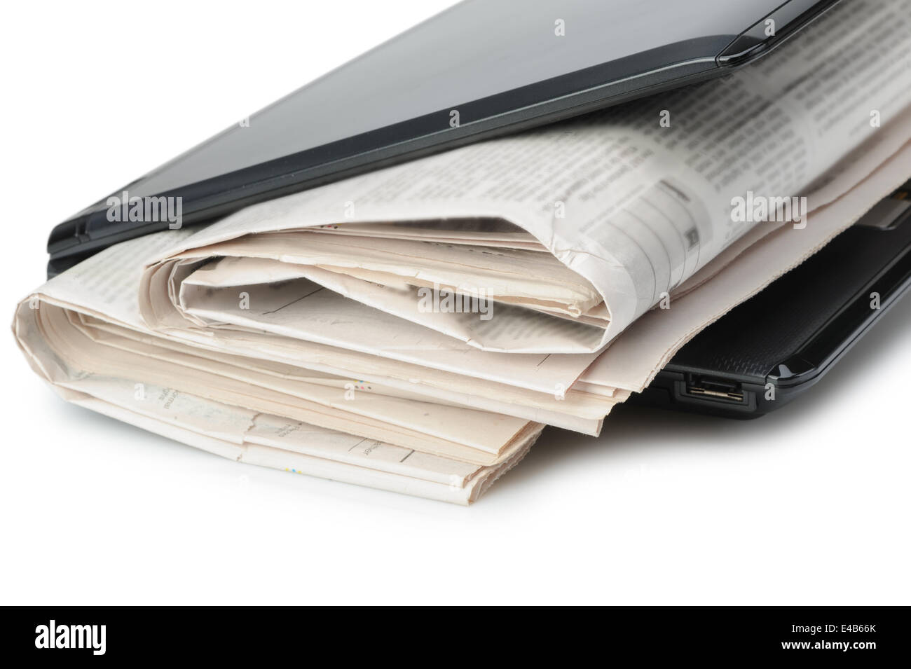 Newspaper and a laptop Stock Photo - Alamy
