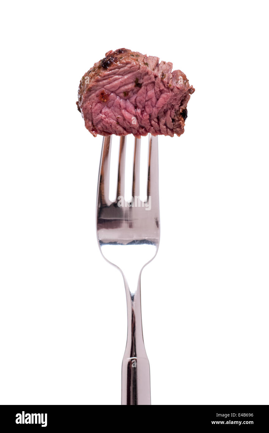 Roasted ostrich meat on a fork Stock Photo - Alamy