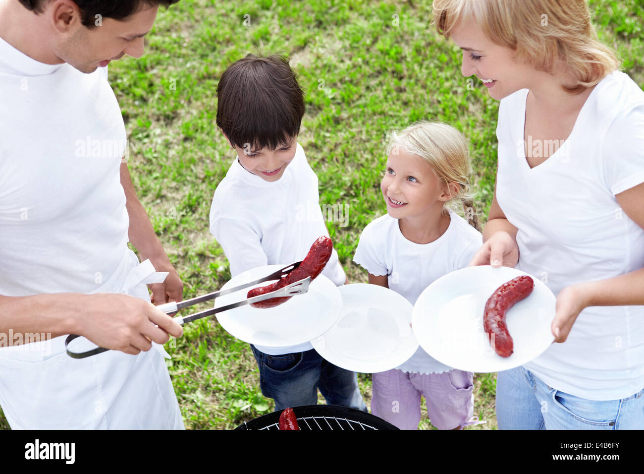 Family kids hungry parents hi-res stock photography and images - Alamy