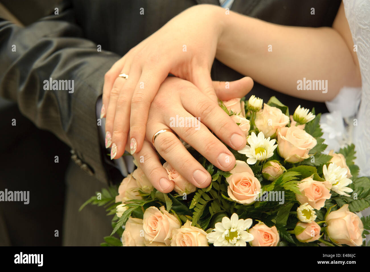 Hands of a newly-married couple Stock Photo - Alamy