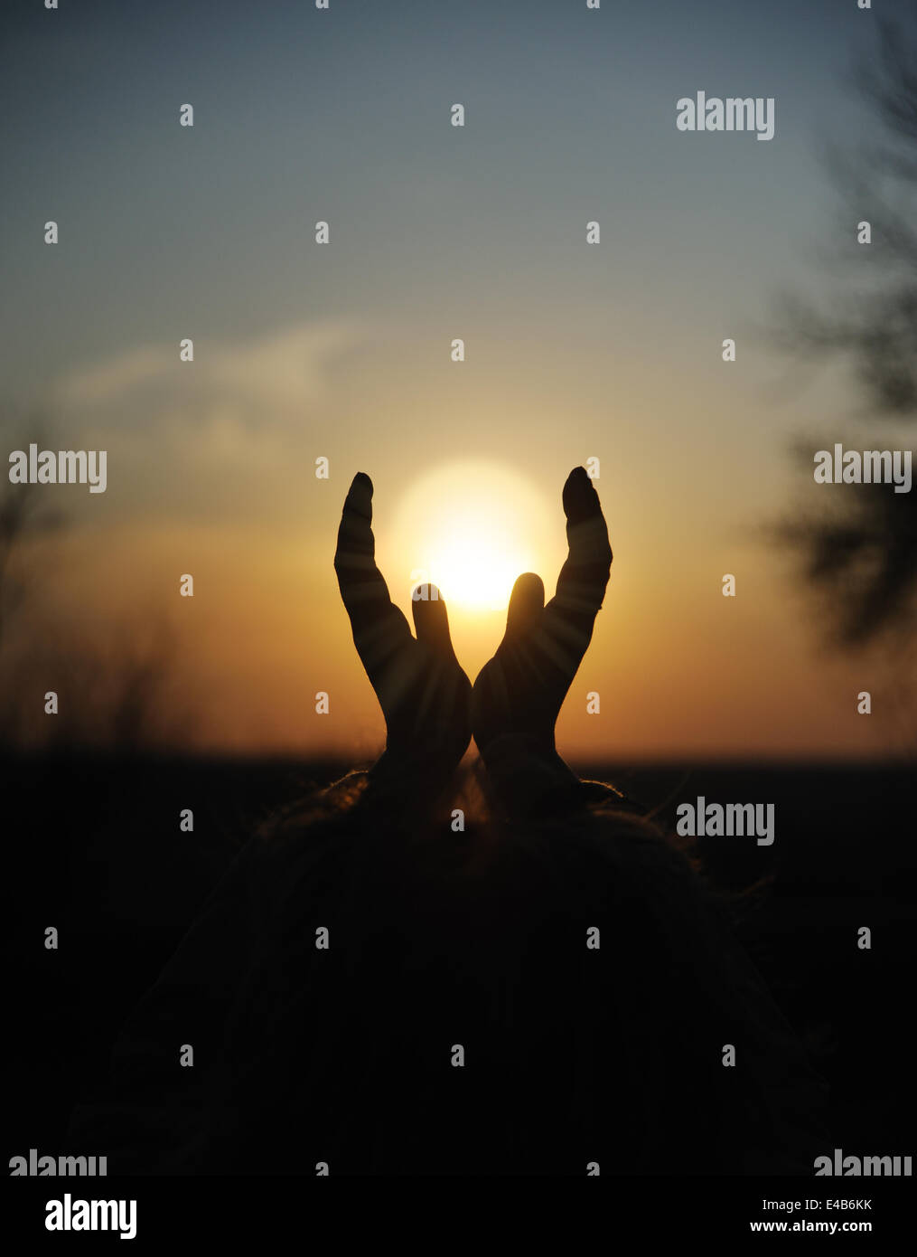 Sunset in hands Stock Photo - Alamy