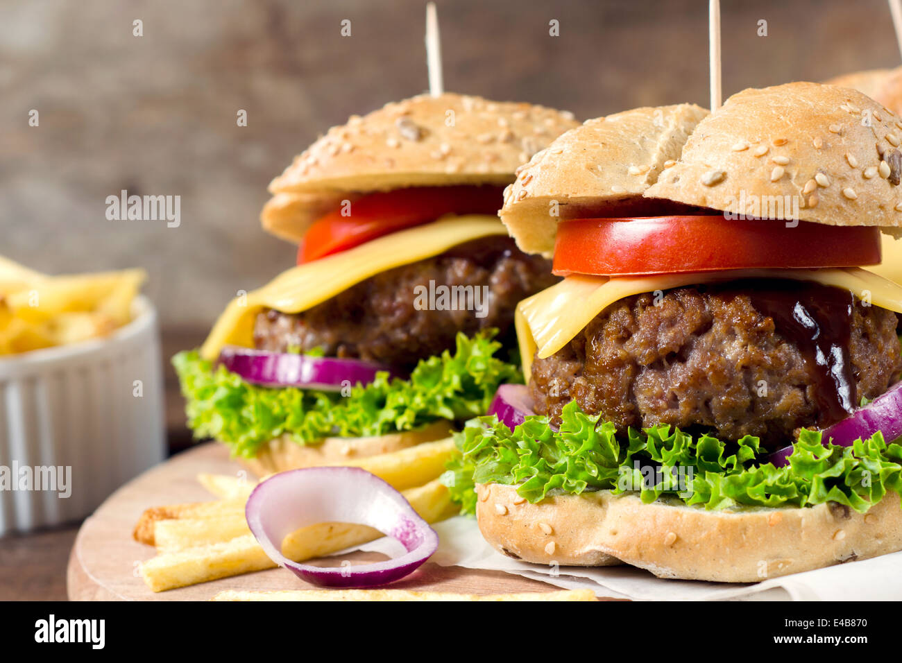 Big and juicy beef meat with cheese and vegetables in the ban.Selective ...