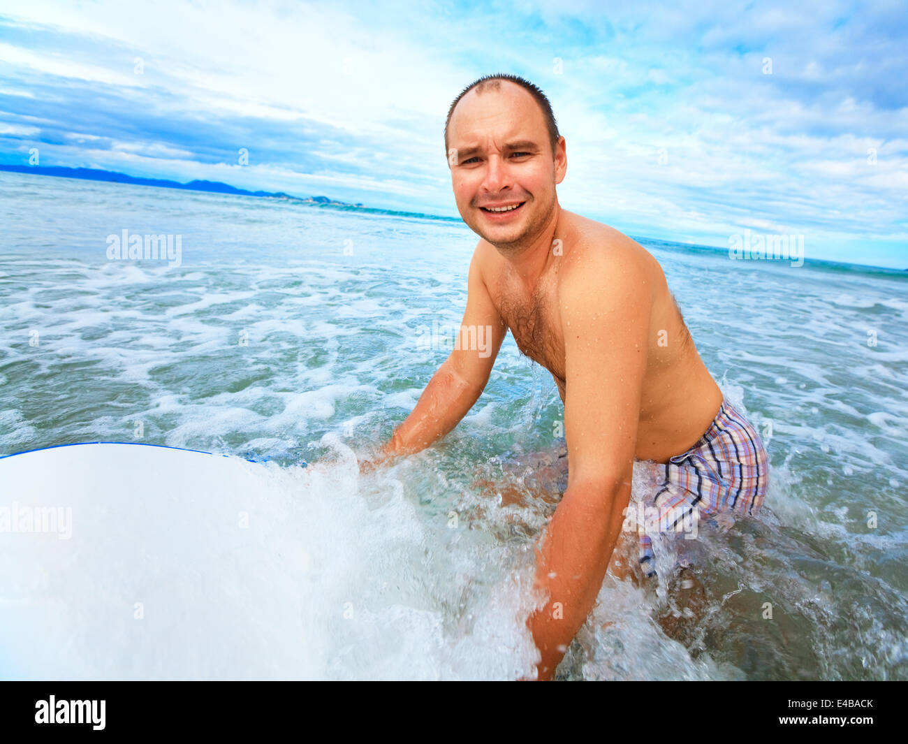 Man with body board Stock Photo - Alamy