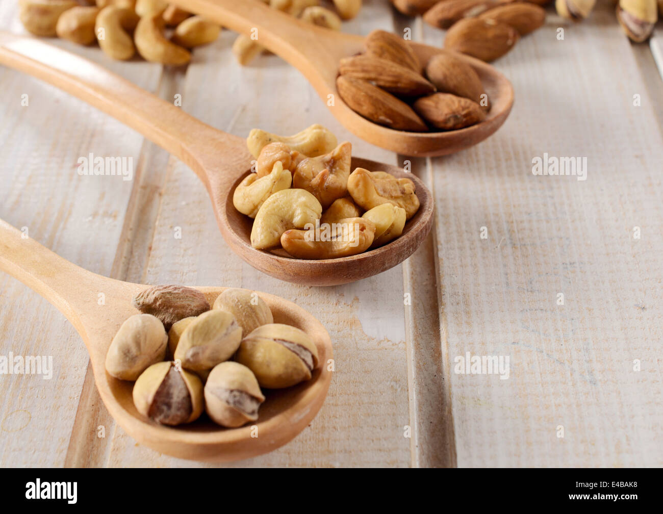 Nuts in the wooden ladle.Selective focus on the cashew nuts in the ...