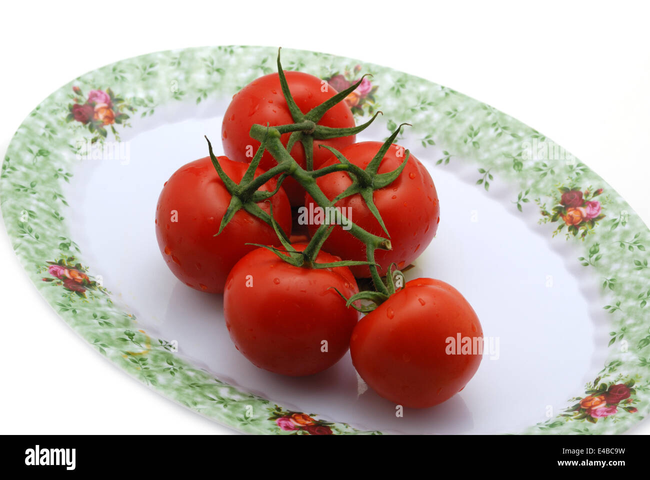 Tomato isolated at dish Stock Photo - Alamy