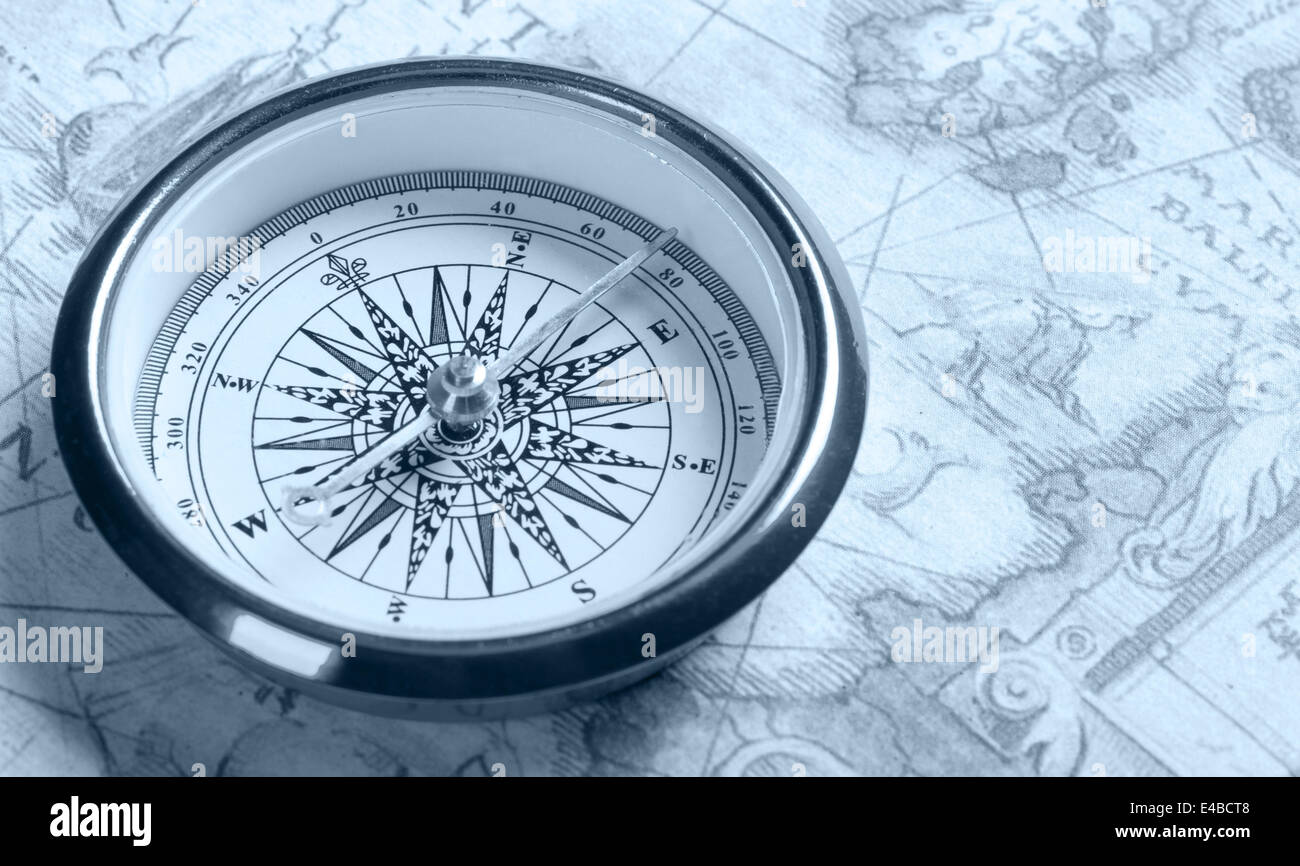 Old compass on ancient map Stock Photo - Alamy