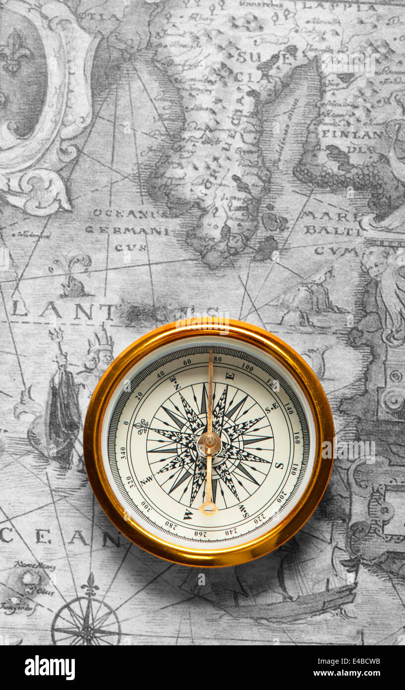Old compass on ancient map Stock Photo - Alamy