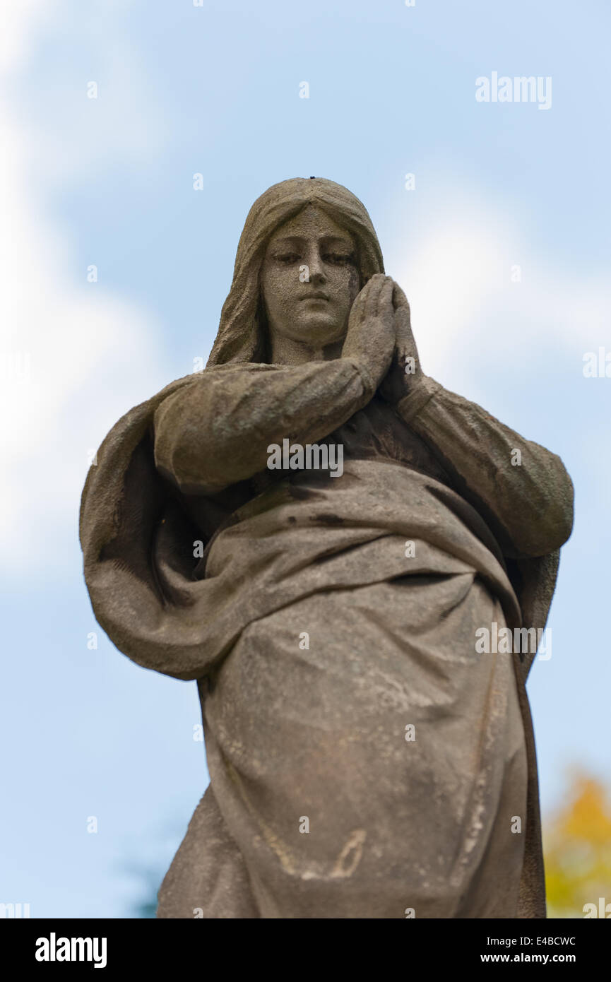 Monument Lady of Guadalupe on a cemetery Stock Photo - Alamy