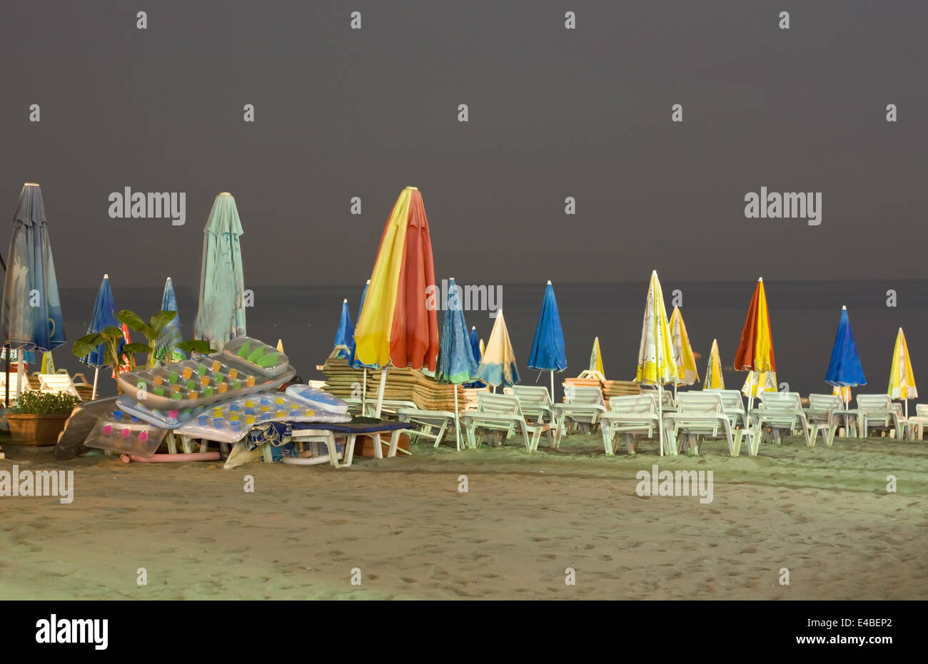 Night beach, umbrellas Stock Photo - Alamy