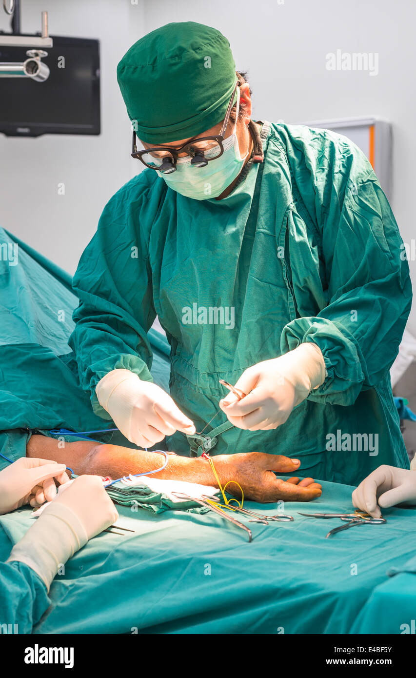 Surgeon operating arteriovenous fistula for long term dialysis for end ...