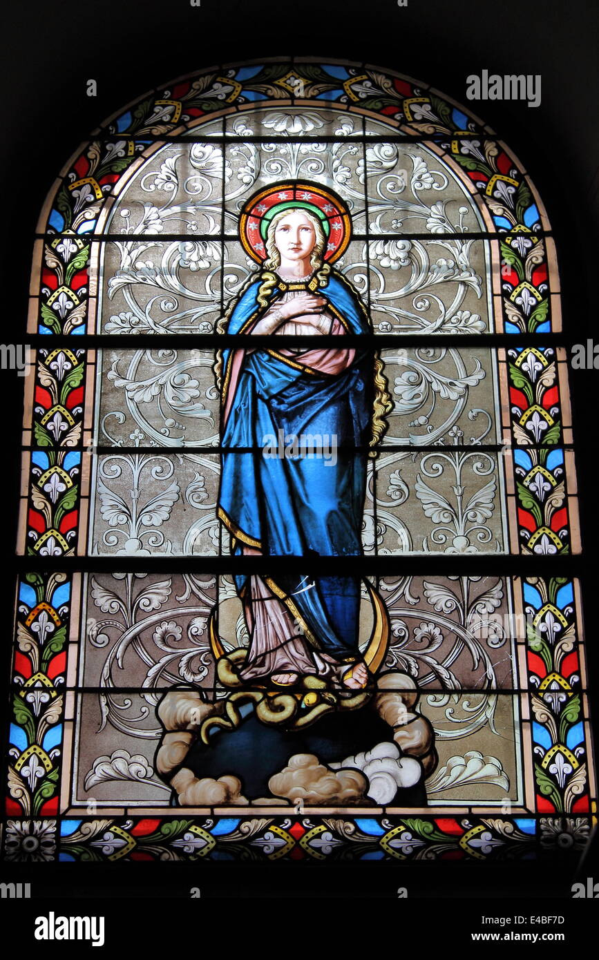 Stained glass window with catholic scenes Stock Photo - Alamy