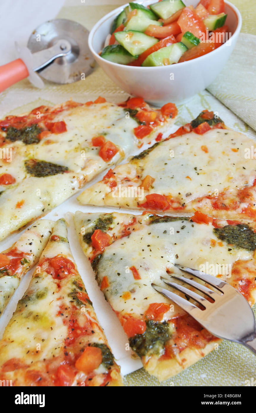 Appetizing pizza with mozzarella cheese and salad Stock Photo - Alamy