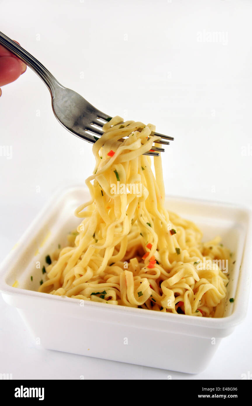 Appetizing Instant noodles with spices. Noodles on a fork Stock Photo ...