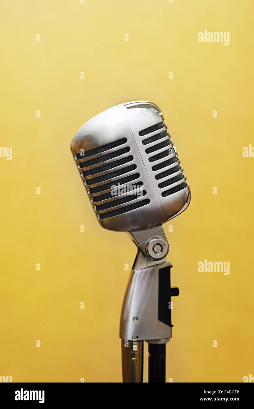 vocal studio microphone over yellow Stock Photo - Alamy