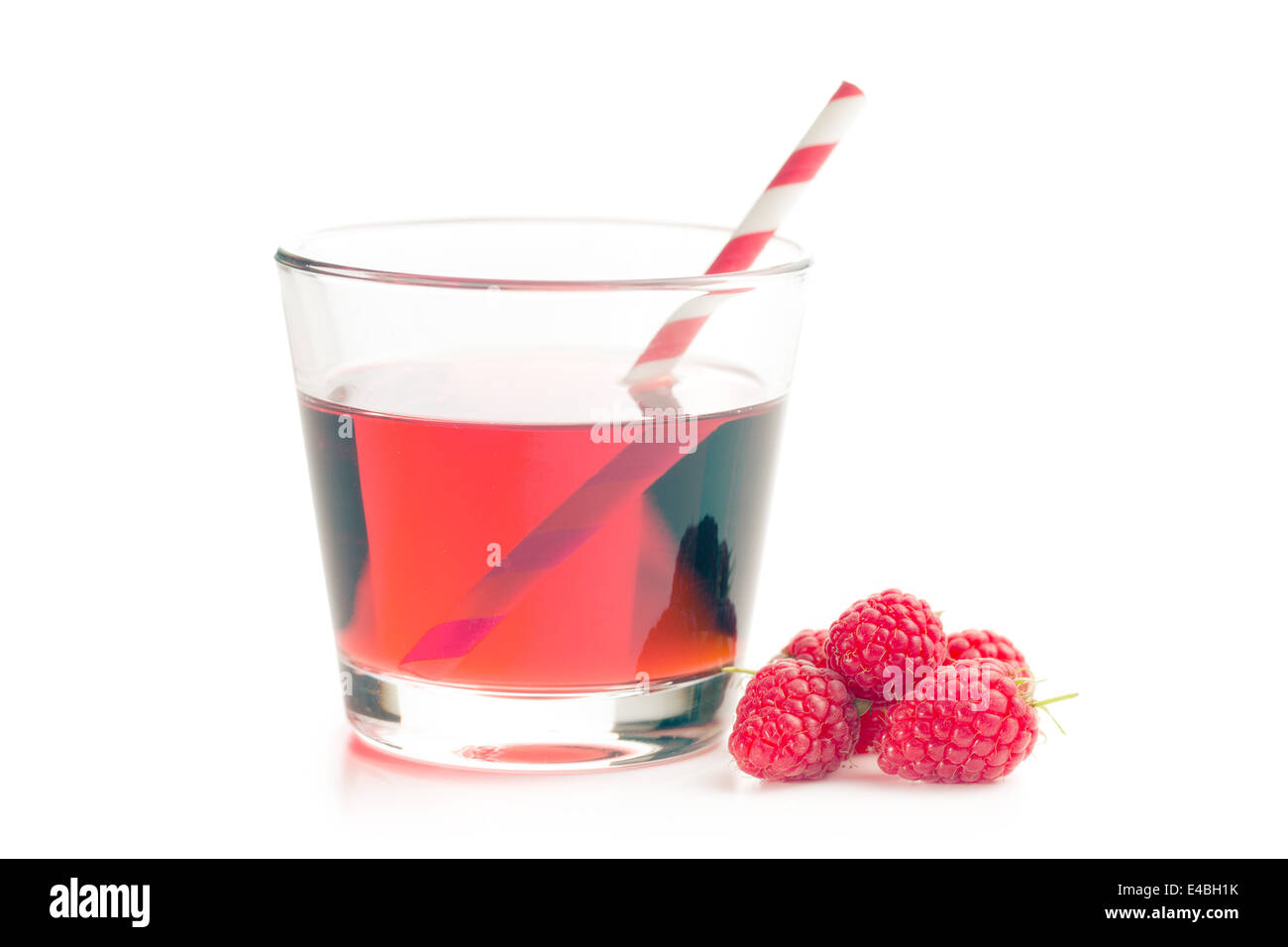 raspberry juice on white background Stock Photo - Alamy