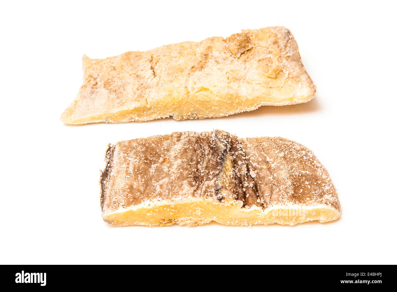 Pieces of salt cod fish isolated on a white studio background Stock ...
