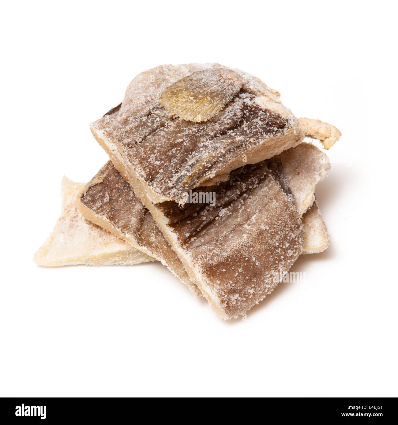 Pieces of salt cod fish isolated on a white studio background Stock ...