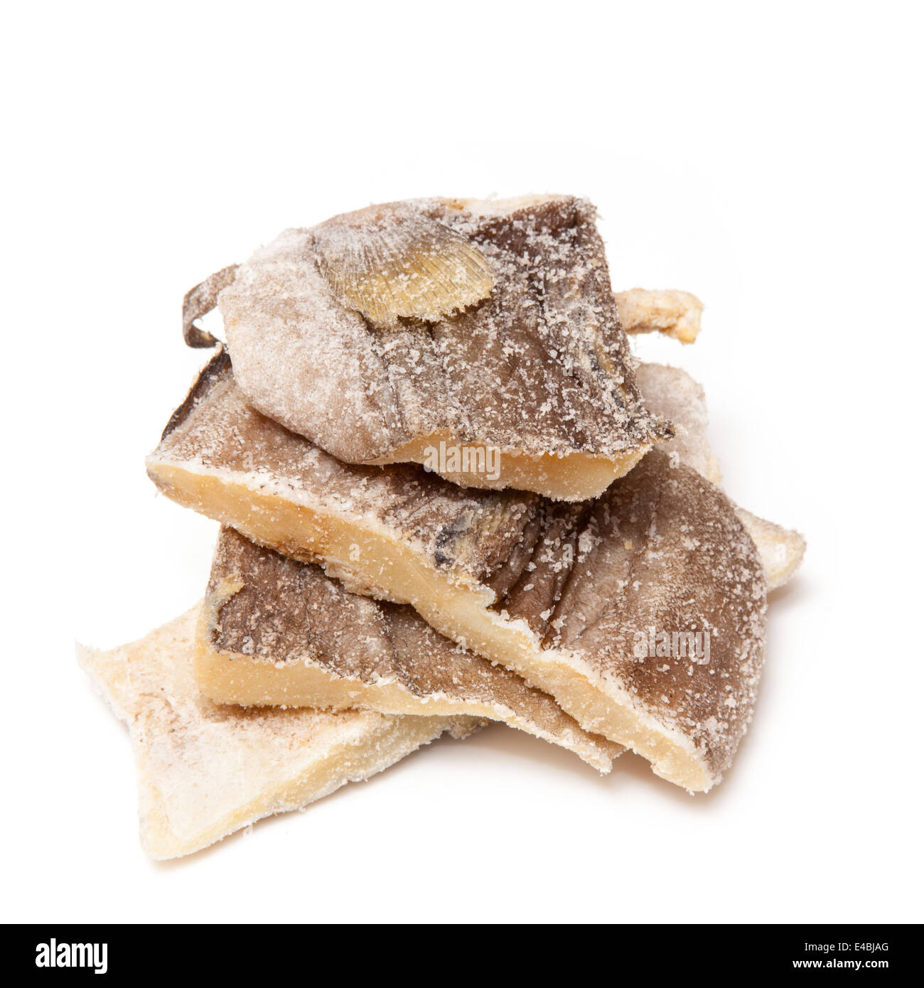 Pieces of salt cod fish isolated on a white studio background Stock ...