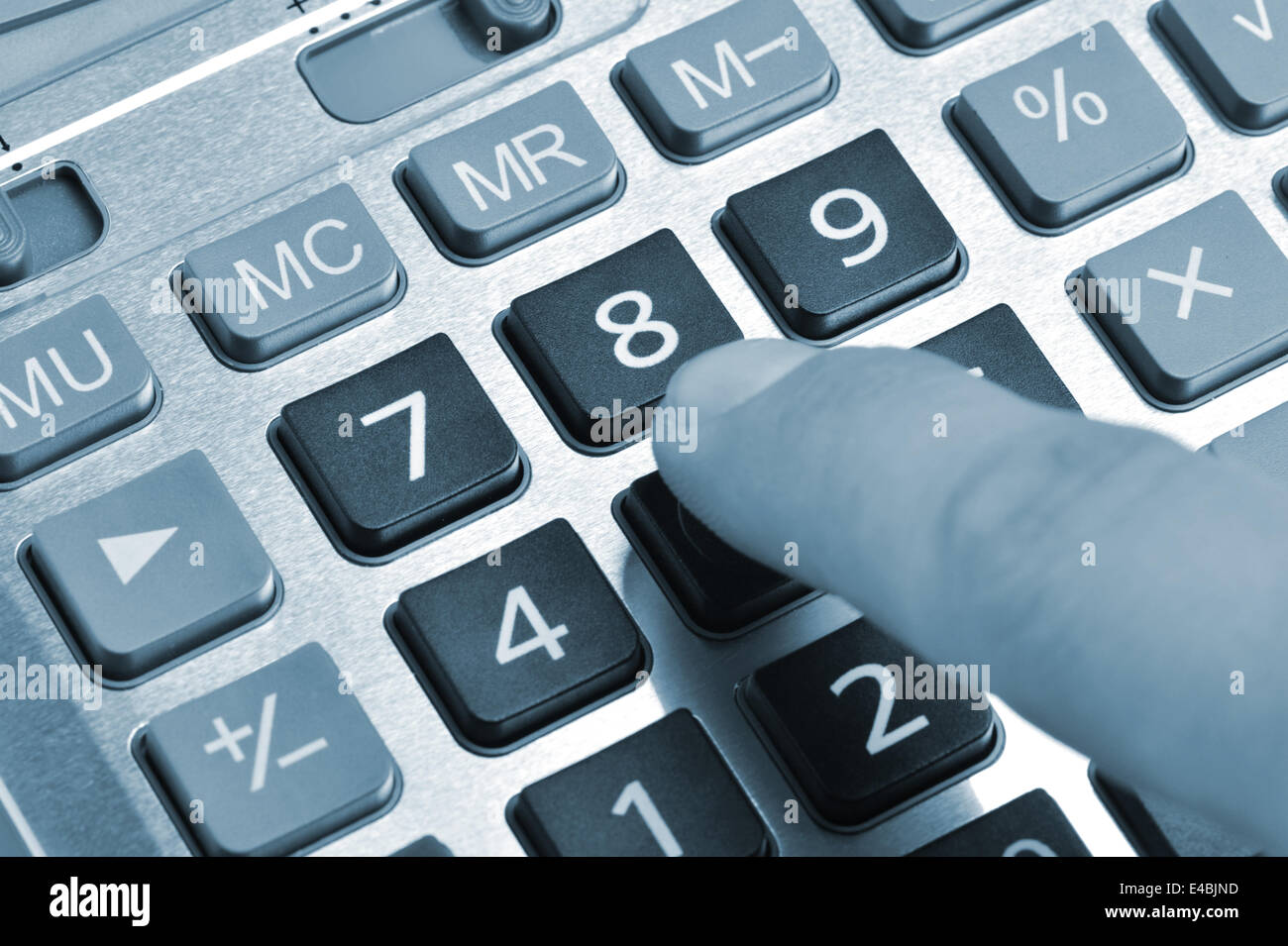 The calculator and a hand of the man Stock Photo - Alamy