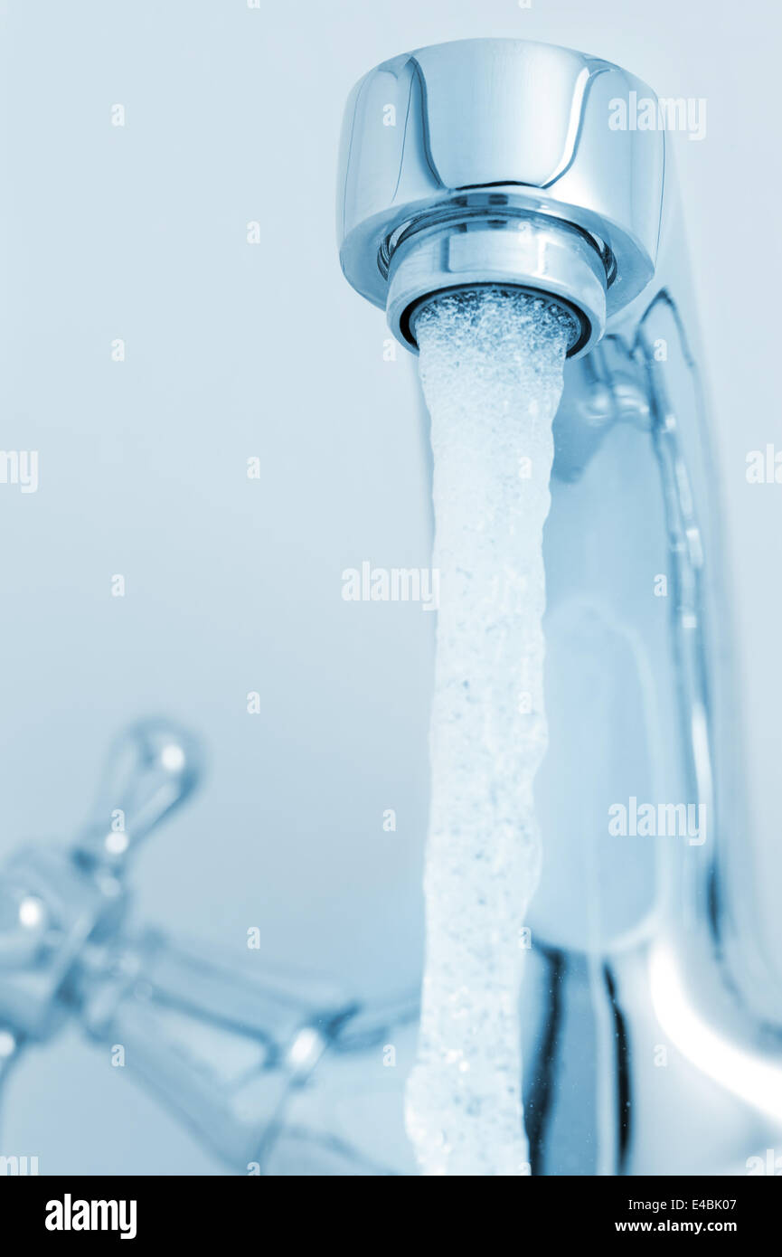 Water tap with a water stream Stock Photo - Alamy