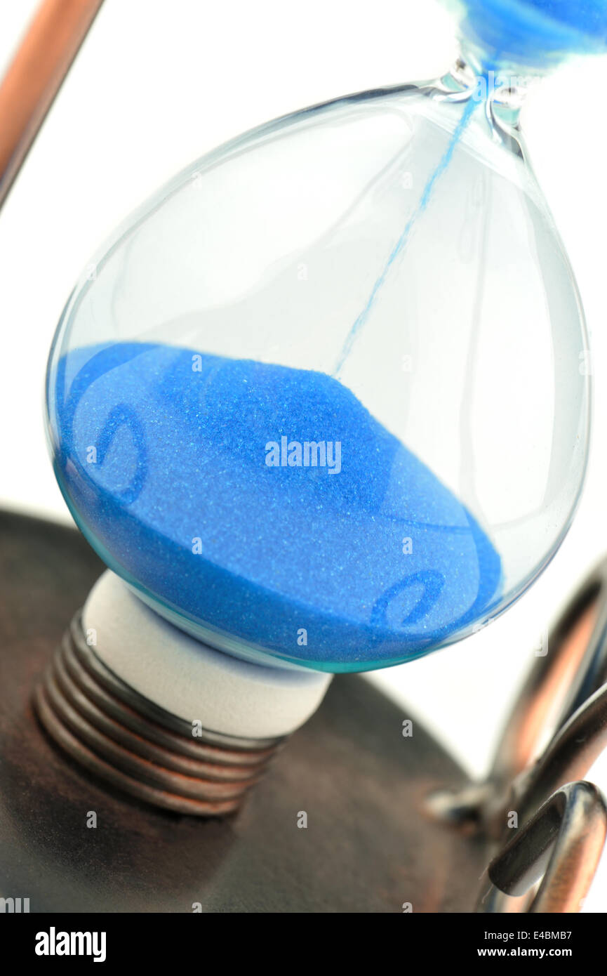 Blue old hourglass flowing sand hi-res stock photography and images - Alamy