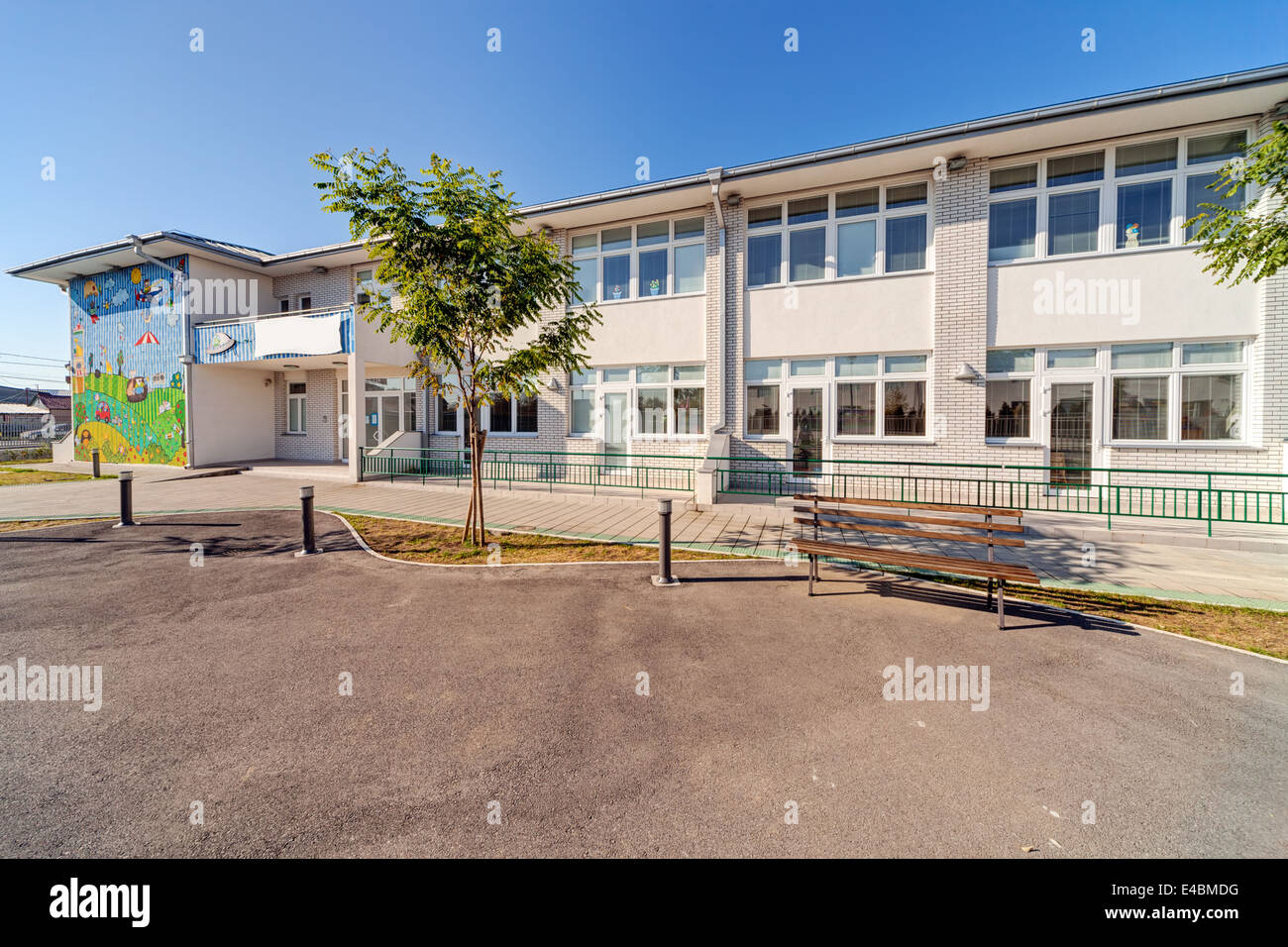preschool building exterior with playground on a sunny day Stock Photo ...