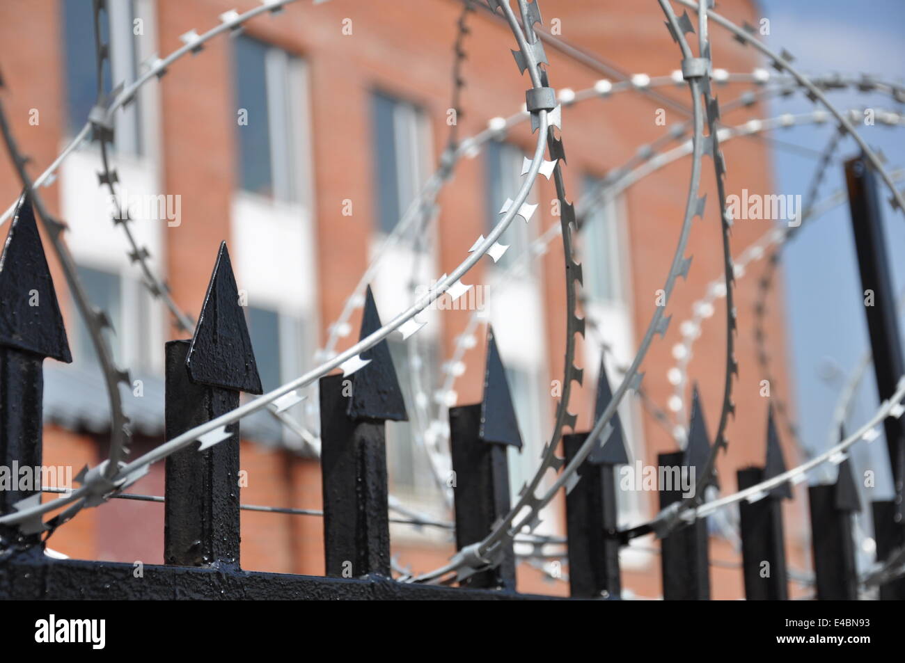 Barbed wire fence at the prison Stock Photo - Alamy