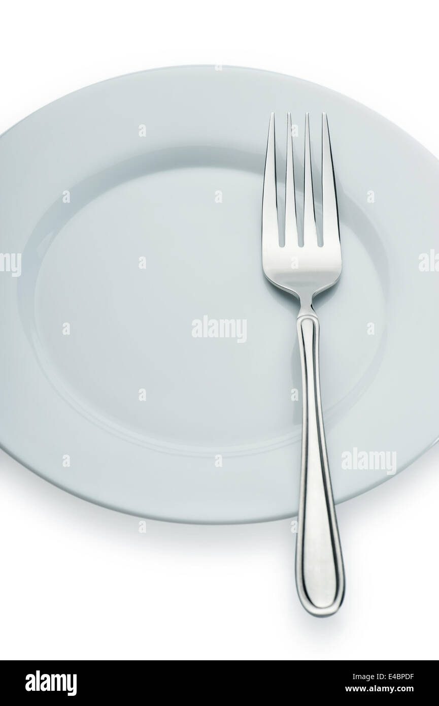 fork on a plate Stock Photo - Alamy