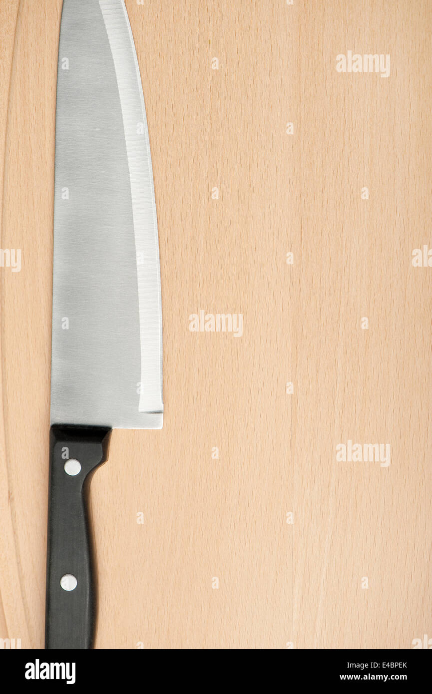Knife and board for cutting food Stock Photo - Alamy