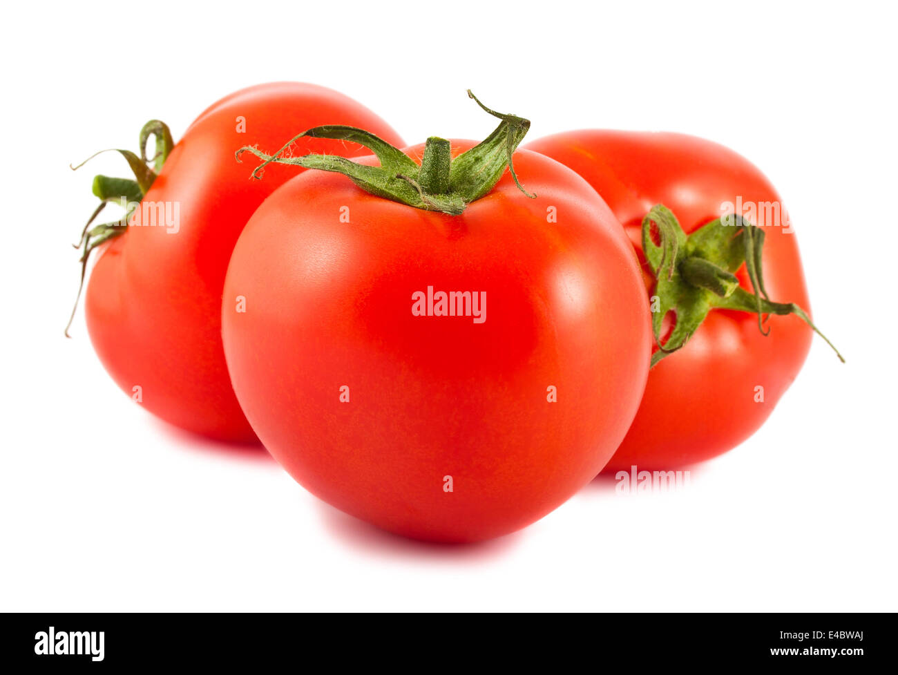 Three red tomatoes Stock Photo - Alamy