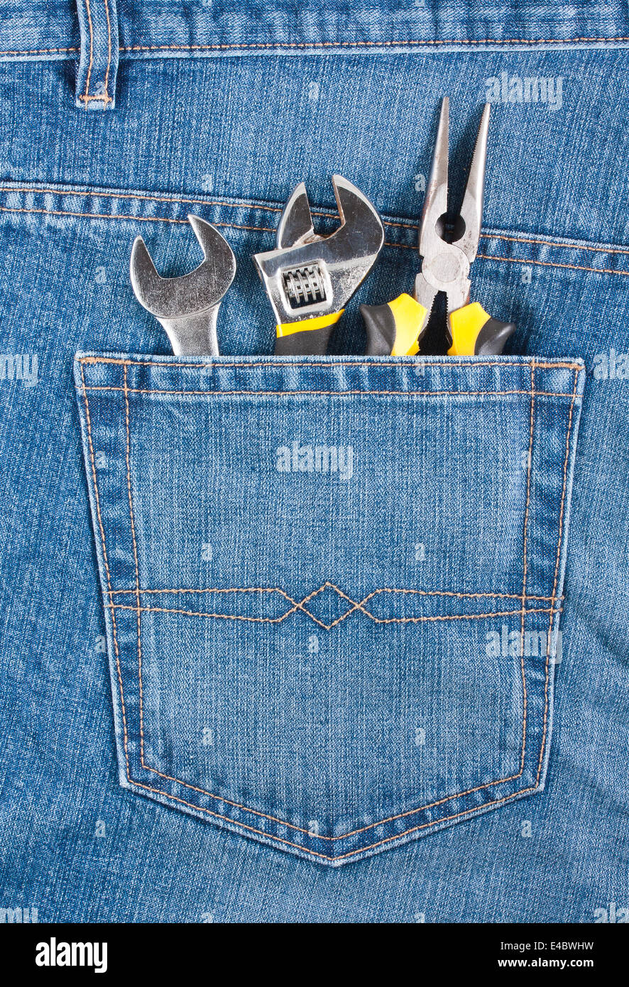Several tools in jeans pocket Stock Photo - Alamy