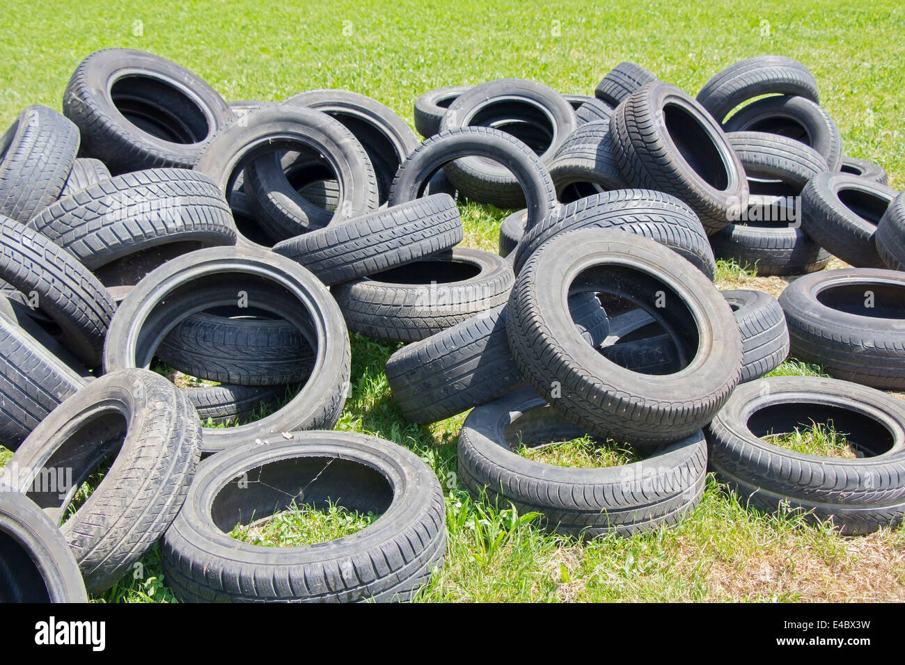 Car tire in grass hi-res stock photography and images - Alamy