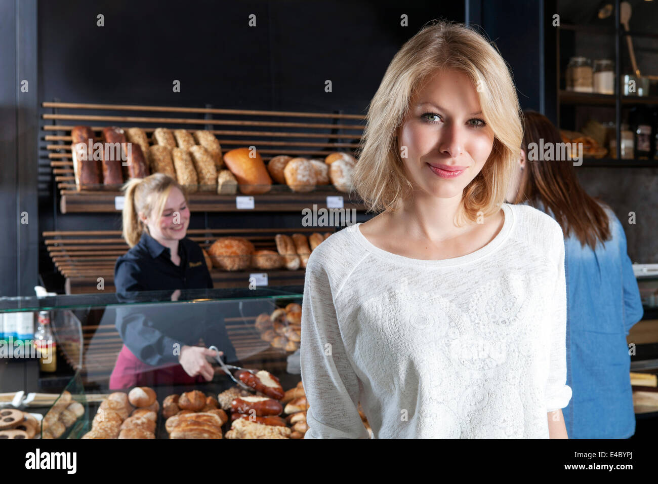 Female customer in a bakery, portrait Stock Photo - Alamy