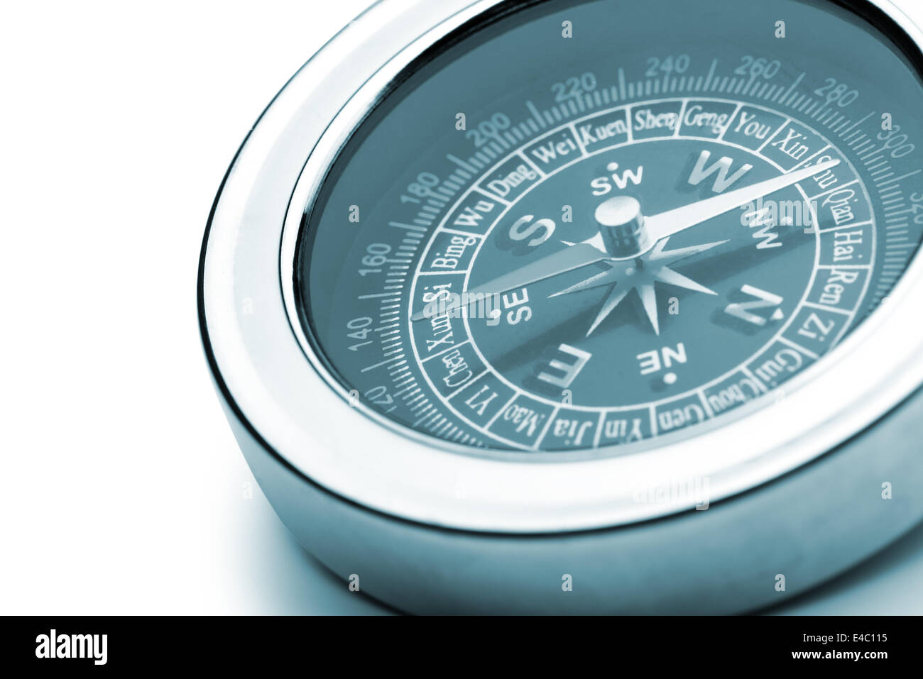 compass closeup blue toned Stock Photo - Alamy