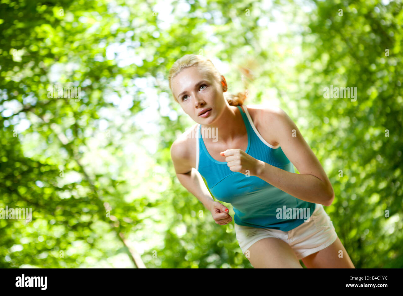 Woman Running Outdoors in Forest Stock Photo - Alamy