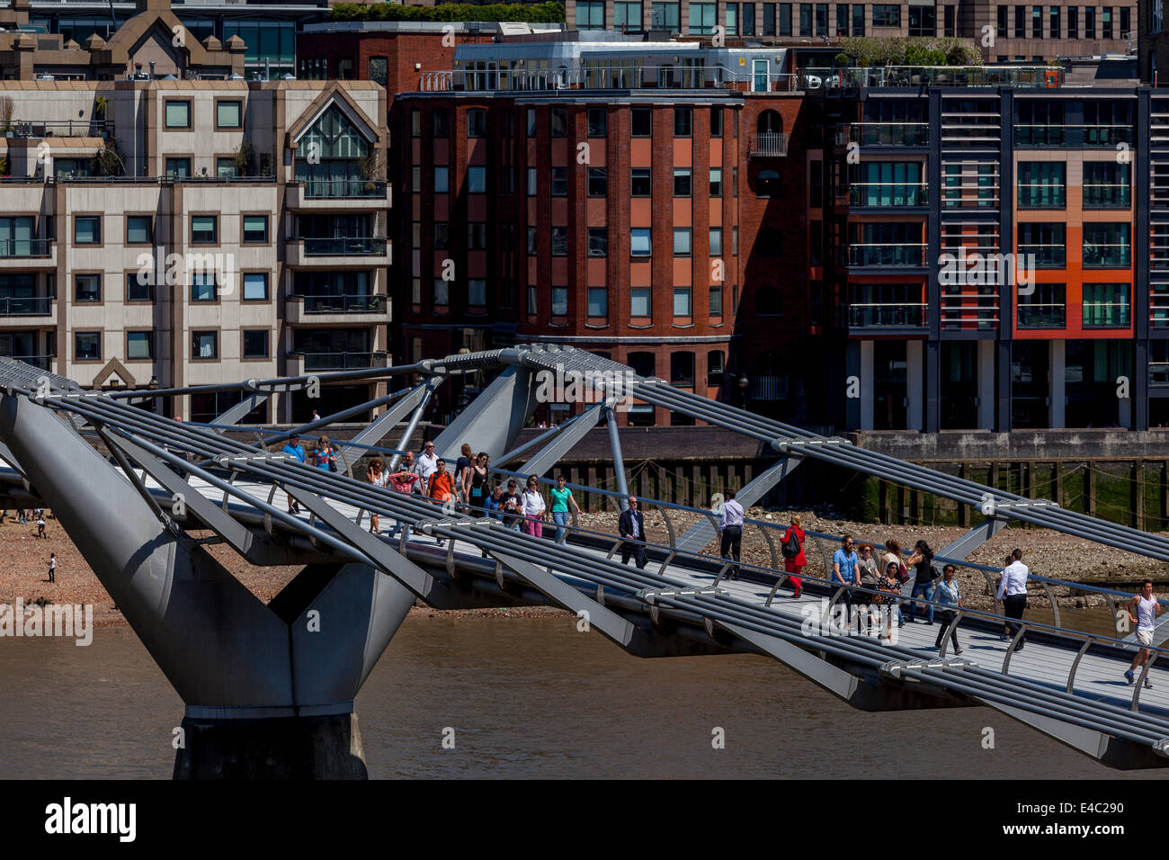 Crossing the millennium bridge hi-res stock photography and images - Alamy