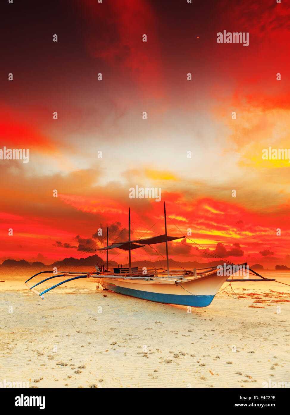 Boat at sunset Stock Photo - Alamy
