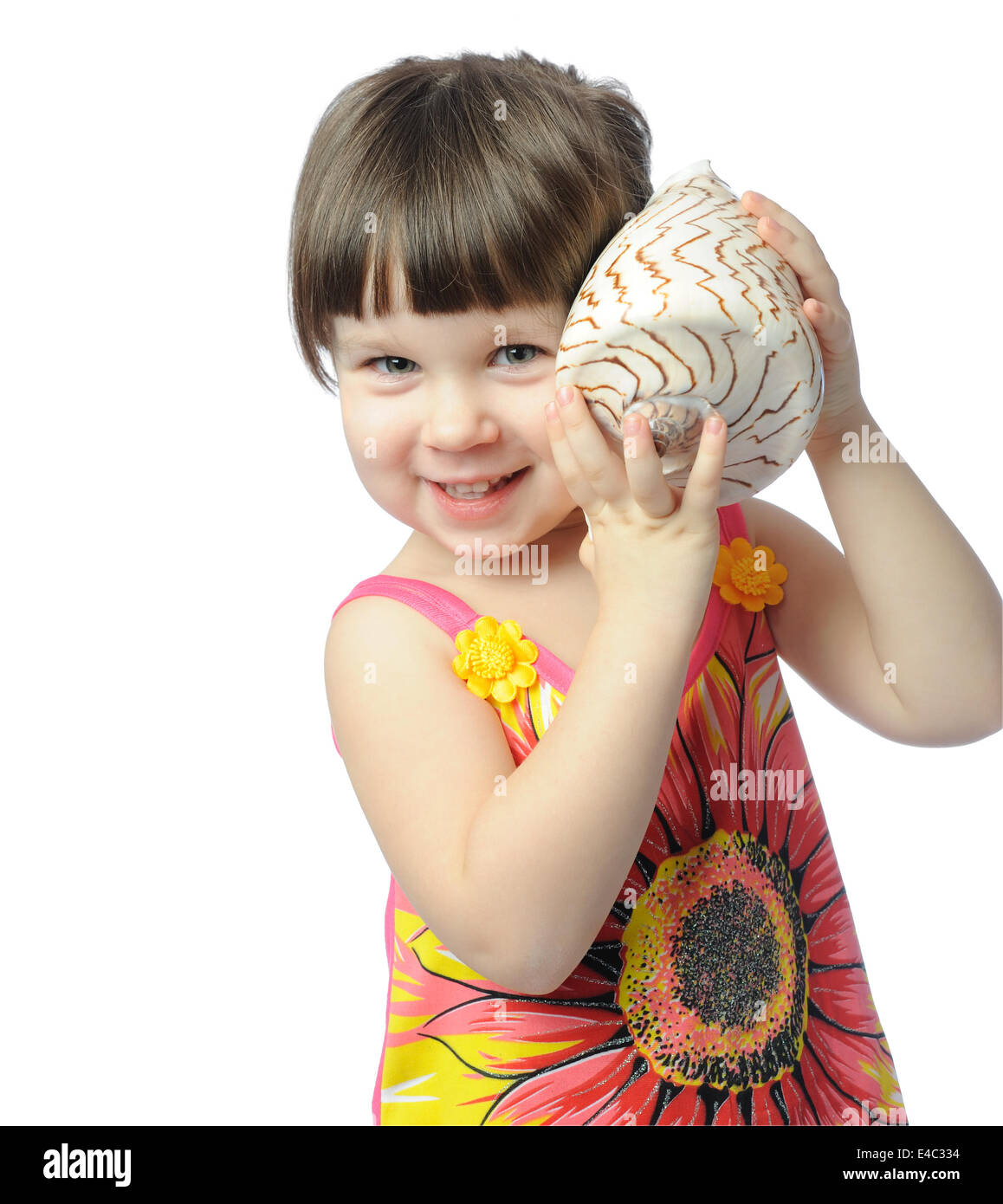 Little girl with seashell hi-res stock photography and images - Alamy
