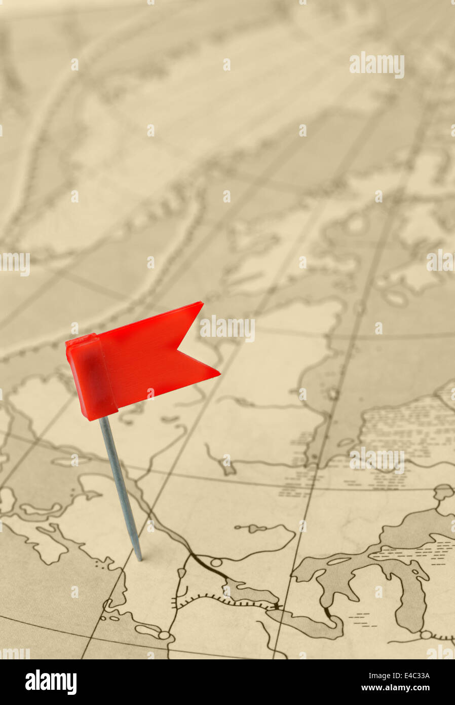 red flag a pin on old map Stock Photo - Alamy